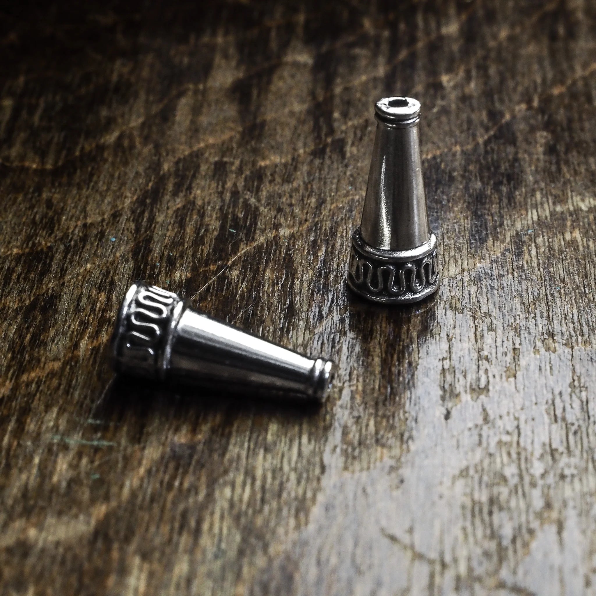 End bead, silver colour